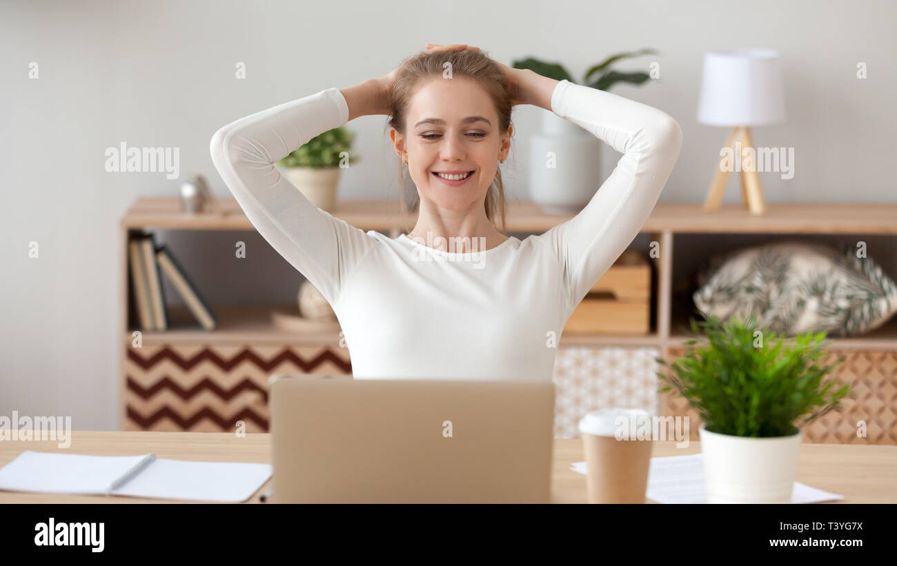 Woman relaxing after finished computer work, looking at screen Stock ...