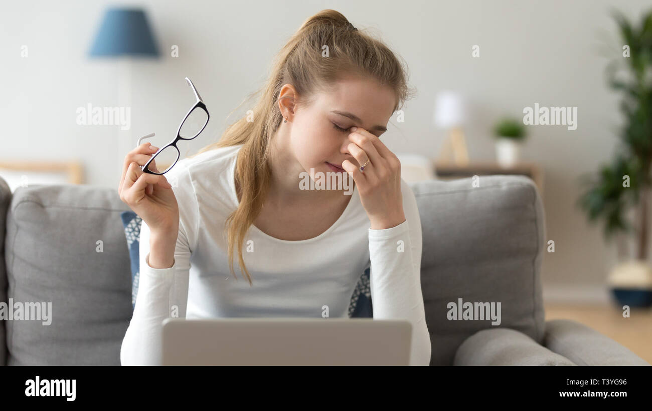 Woman taking off glasses hi-res stock photography and images - Alamy