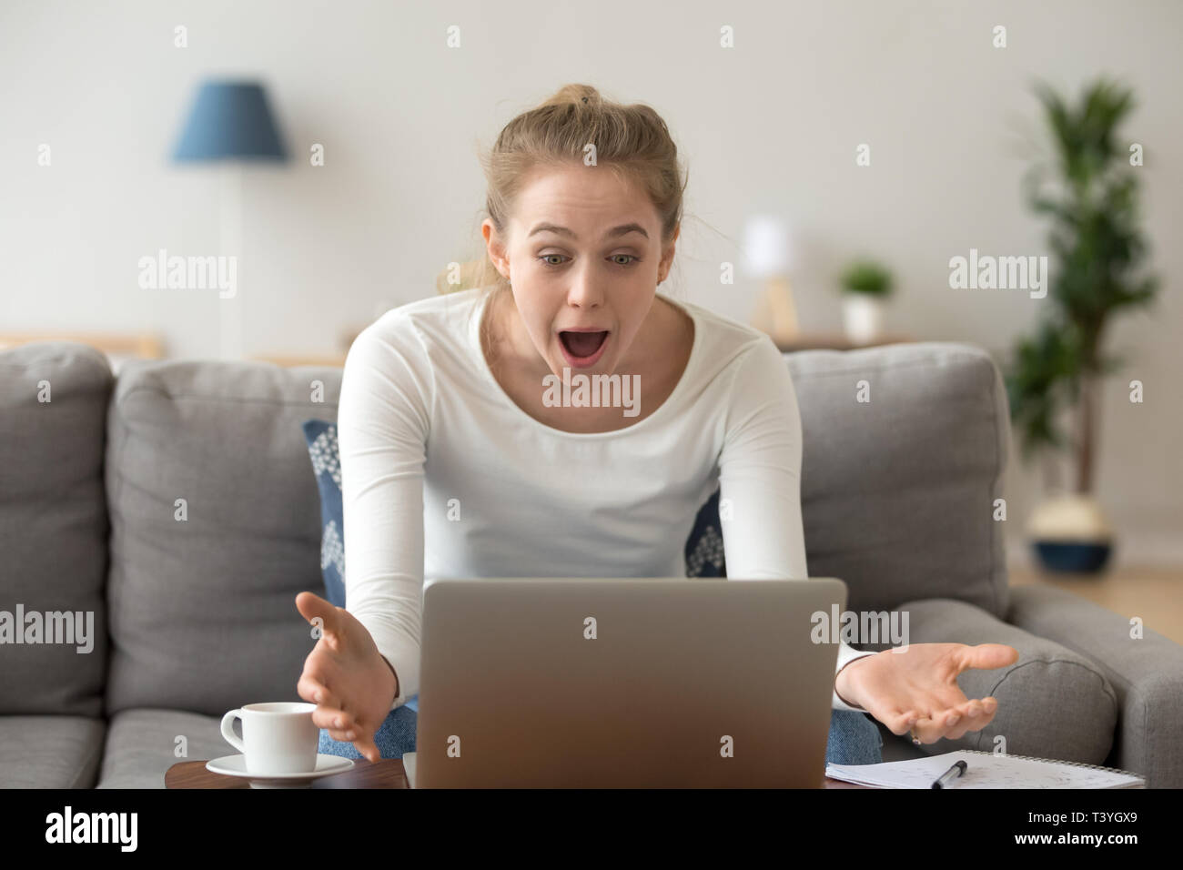 Confused student looking laptop screen hi-res stock photography and ...