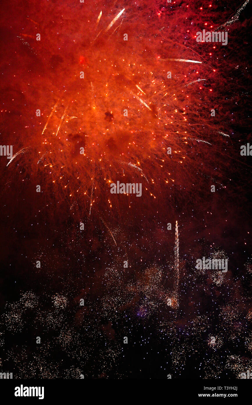 Red fireworks dark background Stock Photo - Alamy