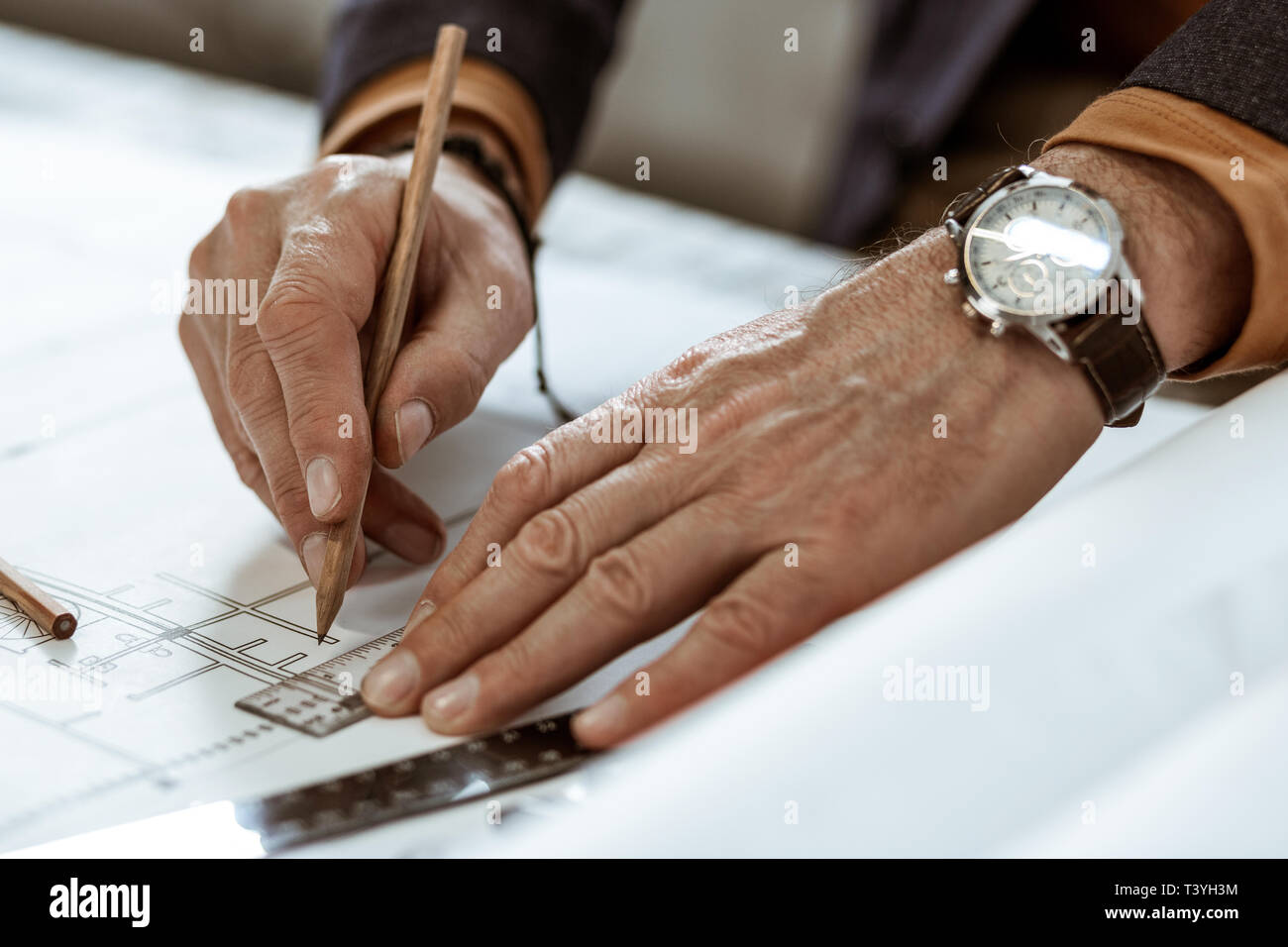 Nice watch. Professional interior designer wearing nice watch holding ...