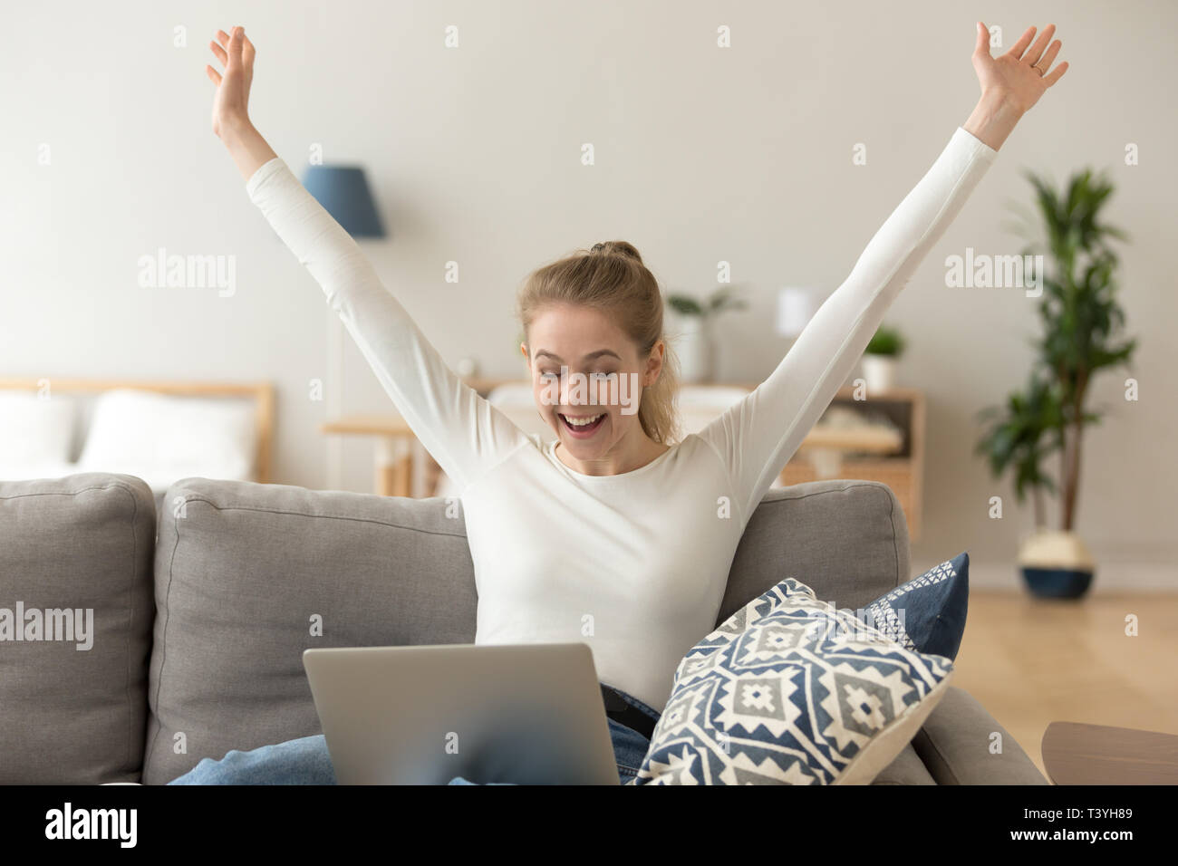 Excited woman computer home hi-res stock photography and images - Alamy