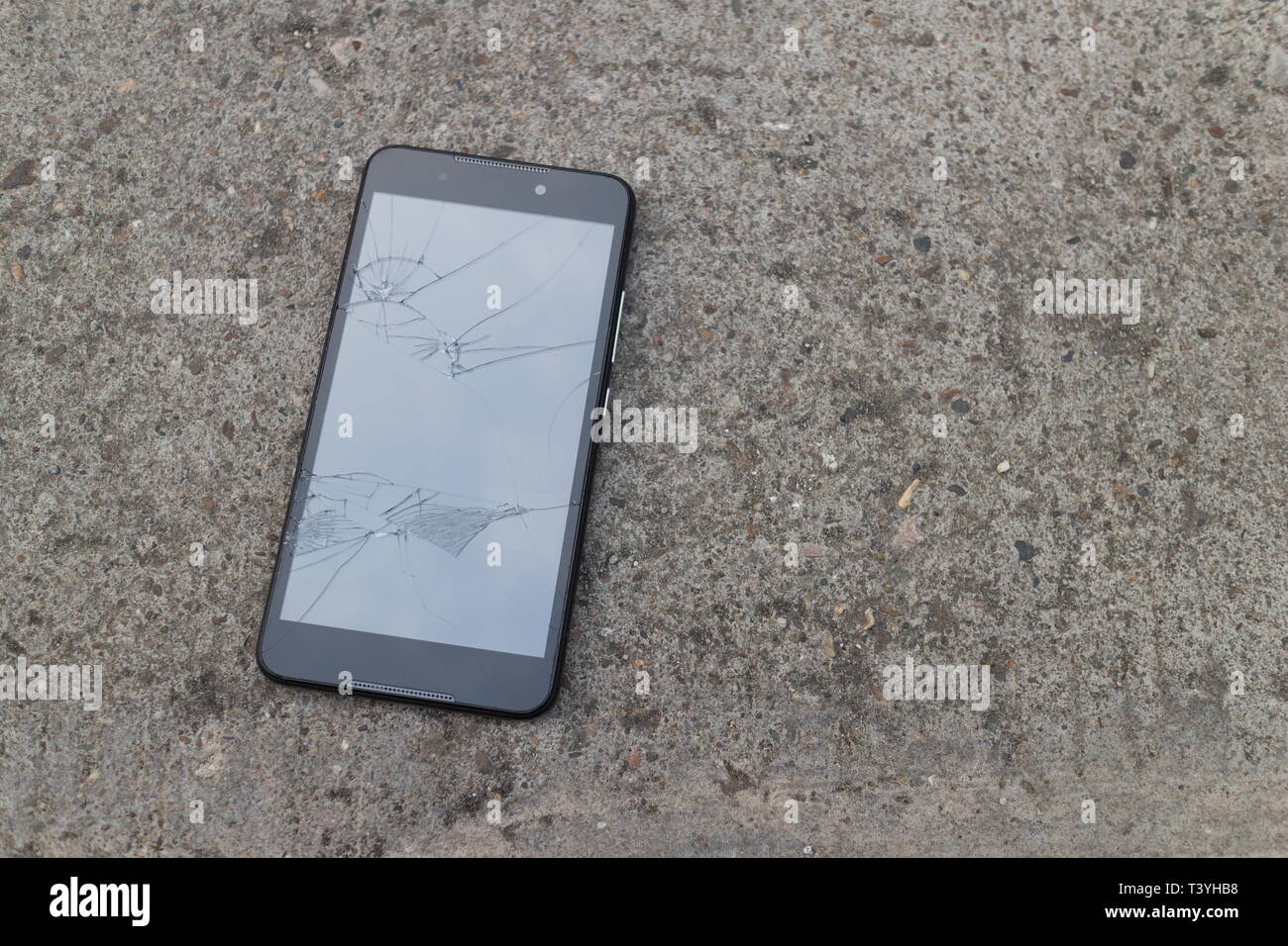 Smartphone mobile fall on the cement floor with touch screen broken ...