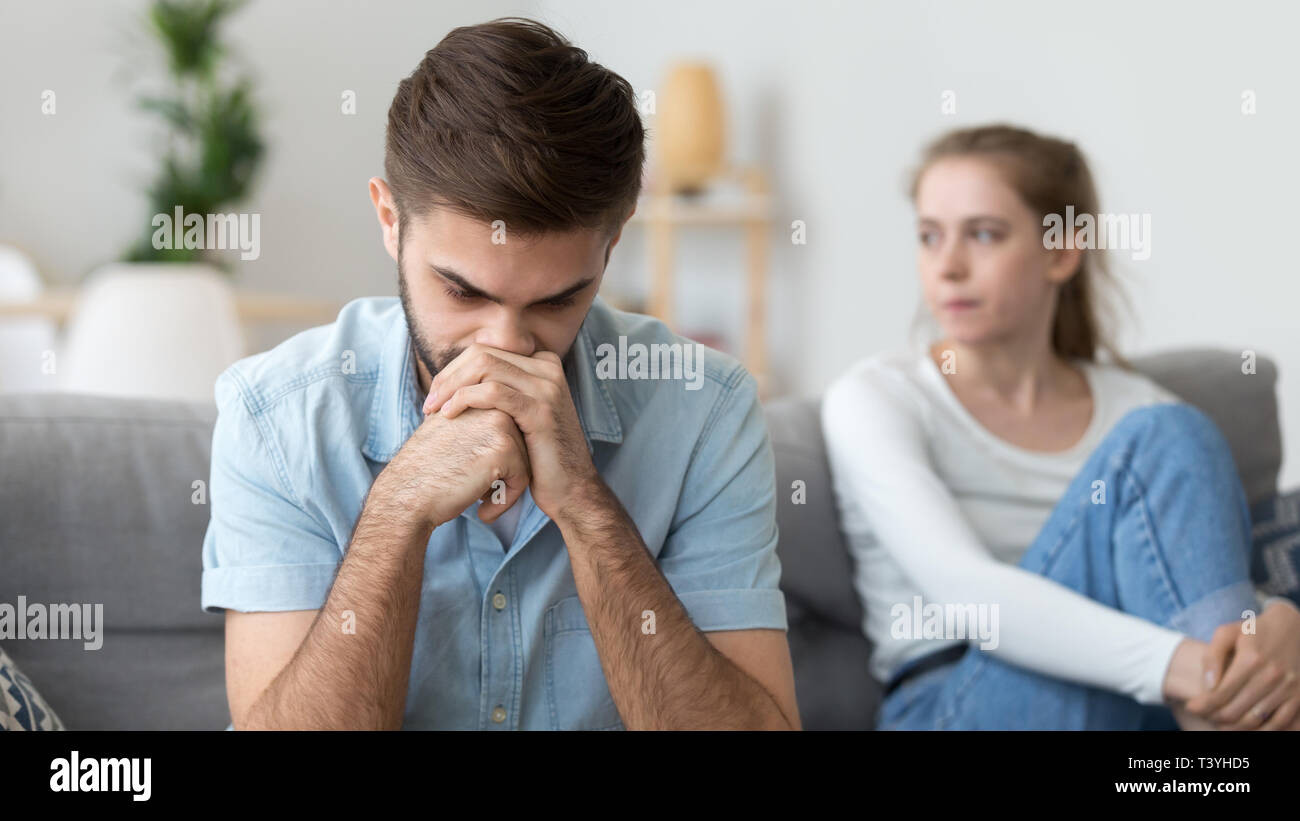 Woman behind man unhappy hi-res stock photography and images - Alamy