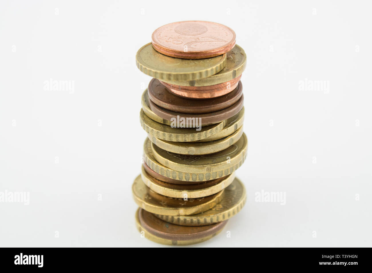 Stack of euro cents coins on white background. Currencies of different ...