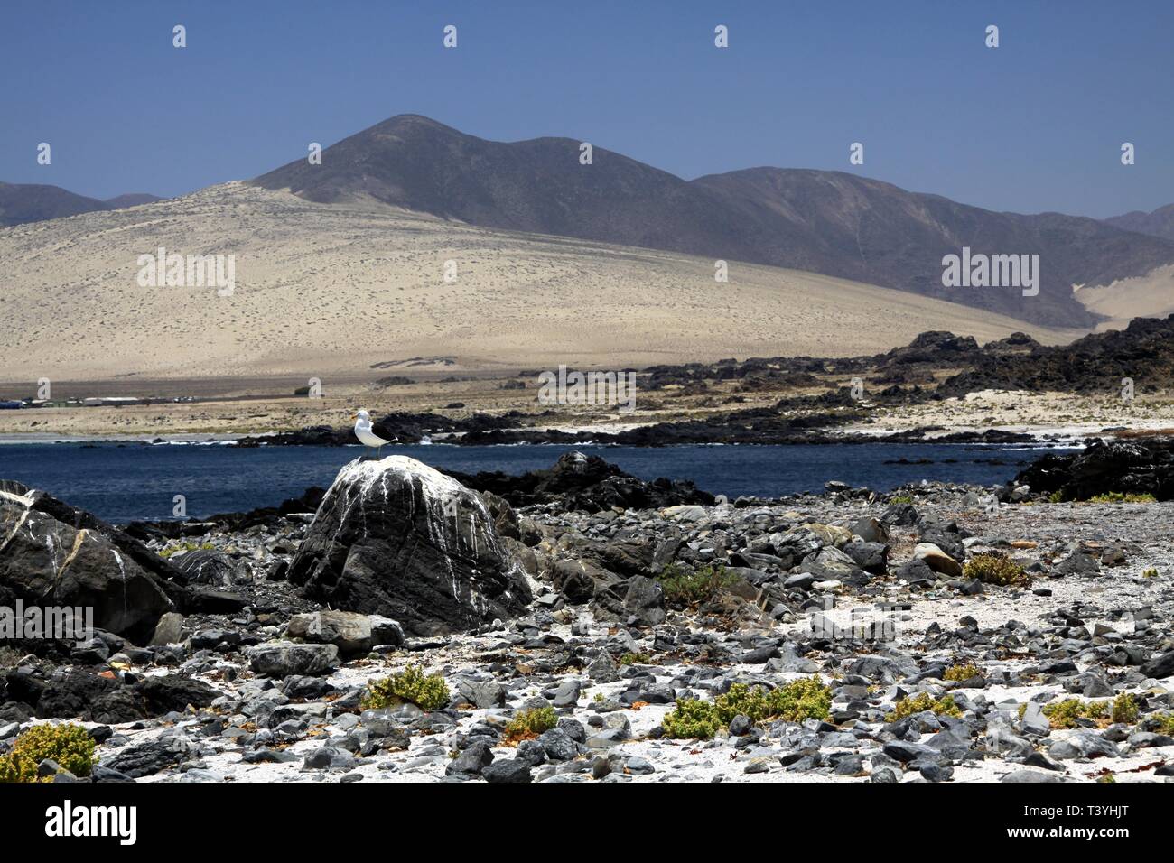 View over rugged stones and lagoon on barren dry mountains - Bahia ...