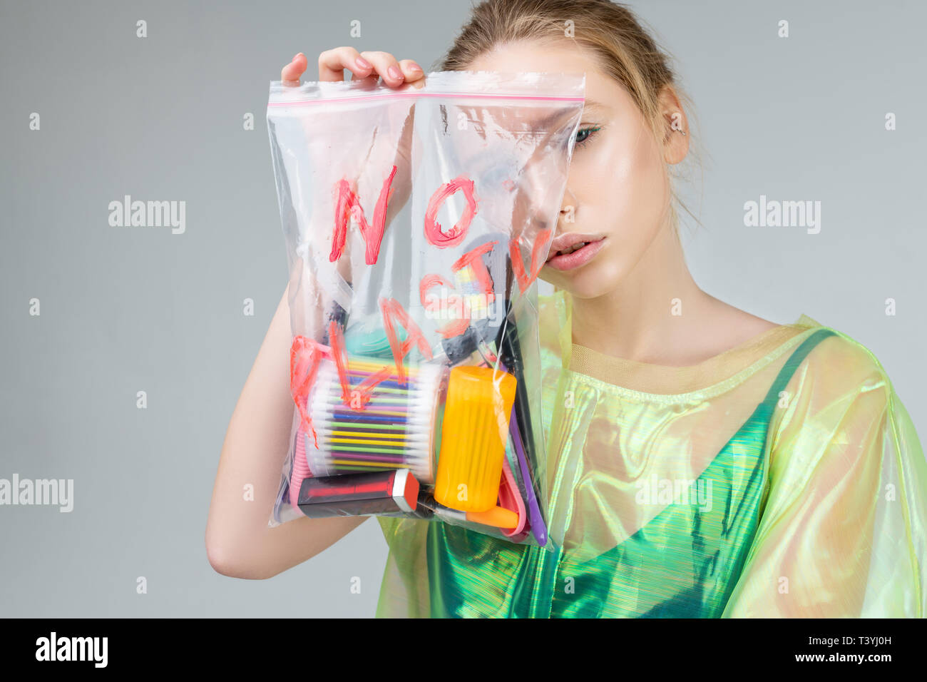 Use less plastic. Modern young but responsible woman encouraging people ...