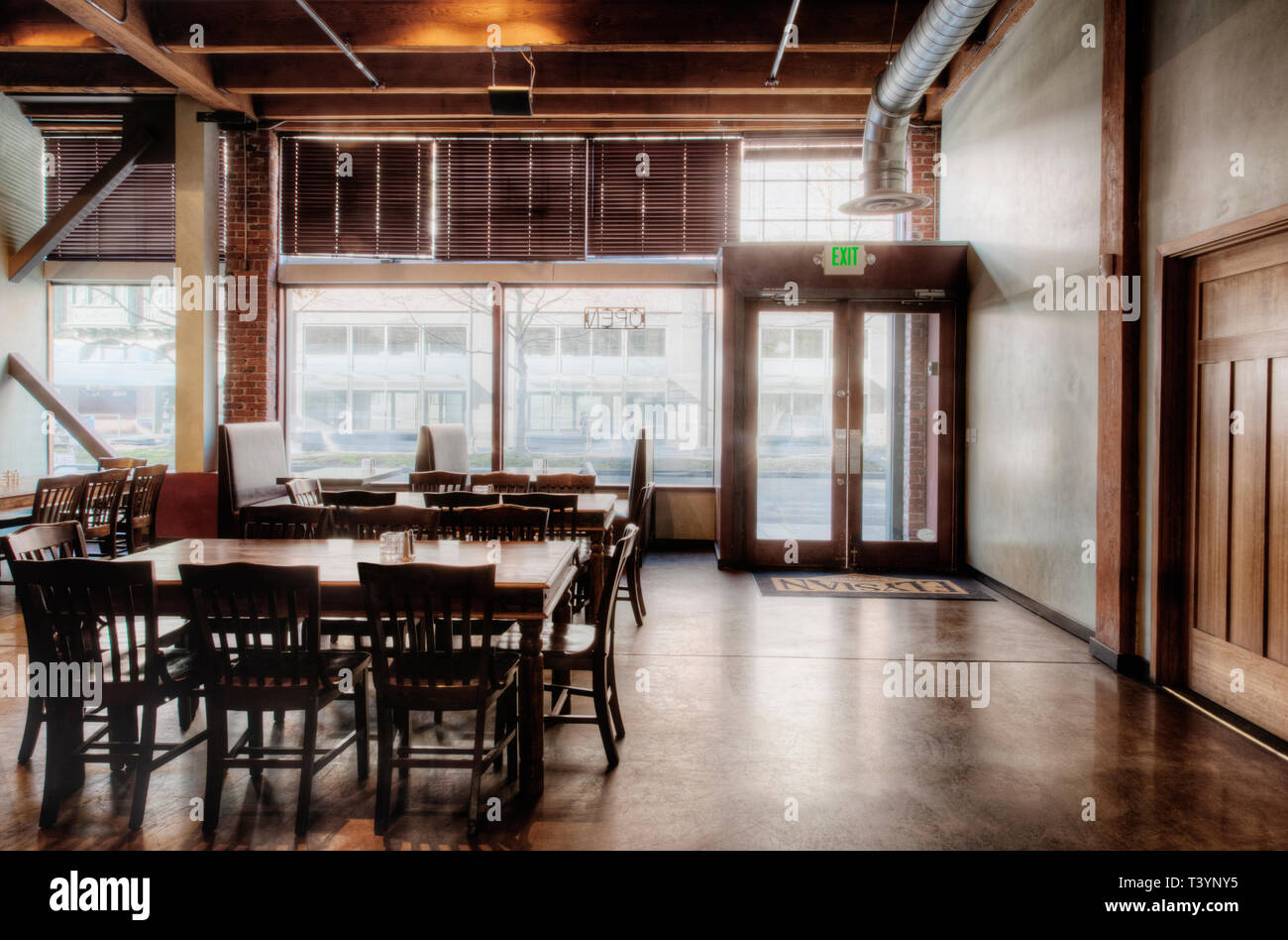 Tables and chairs in empty restaurant Stock Photo - Alamy