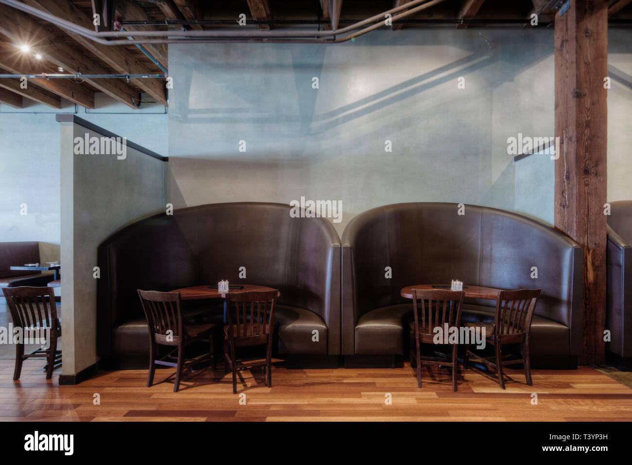 Tables and chairs in empty restaurant Stock Photo - Alamy