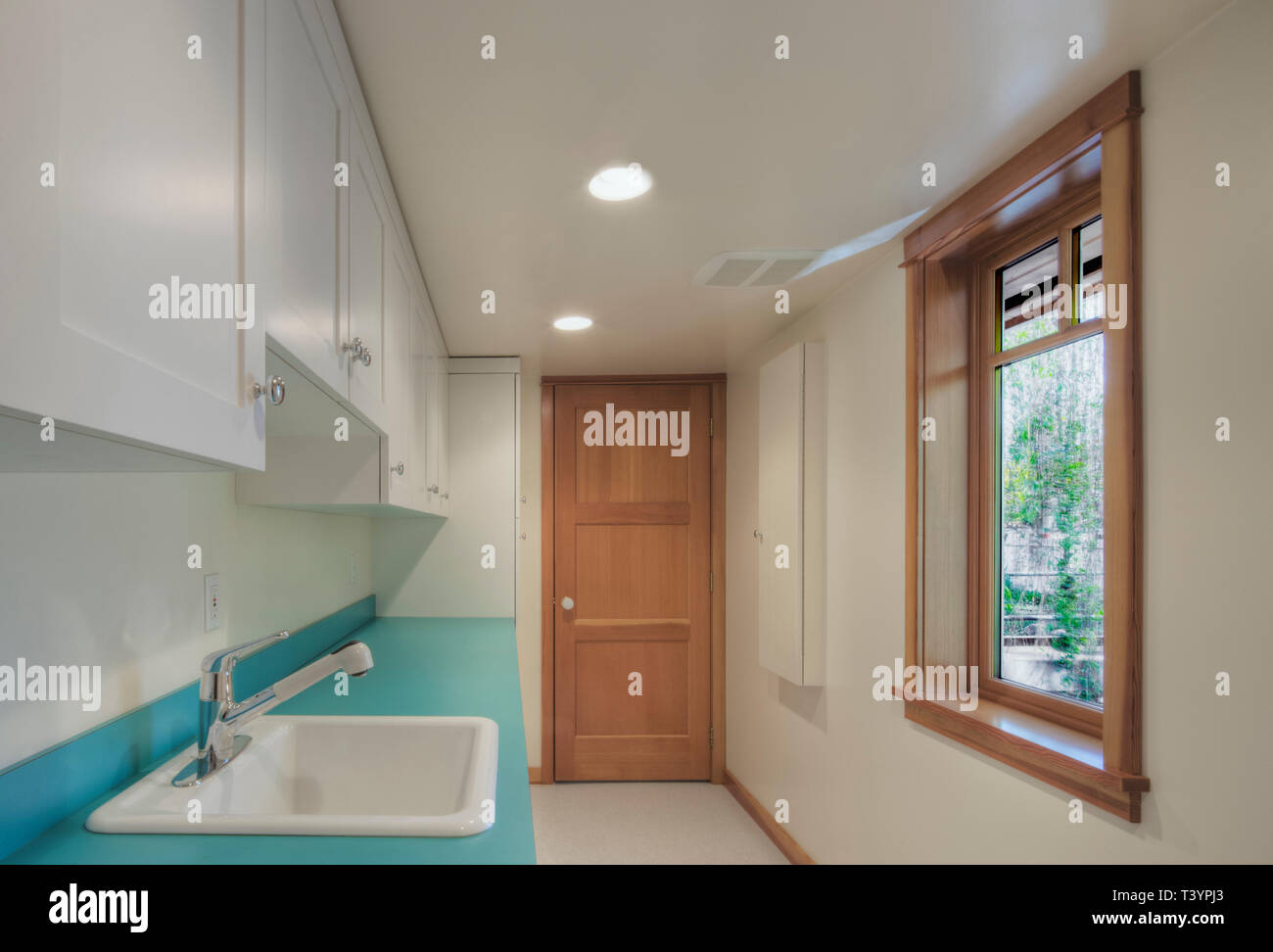 Sink in empty utility room Stock Photo - Alamy