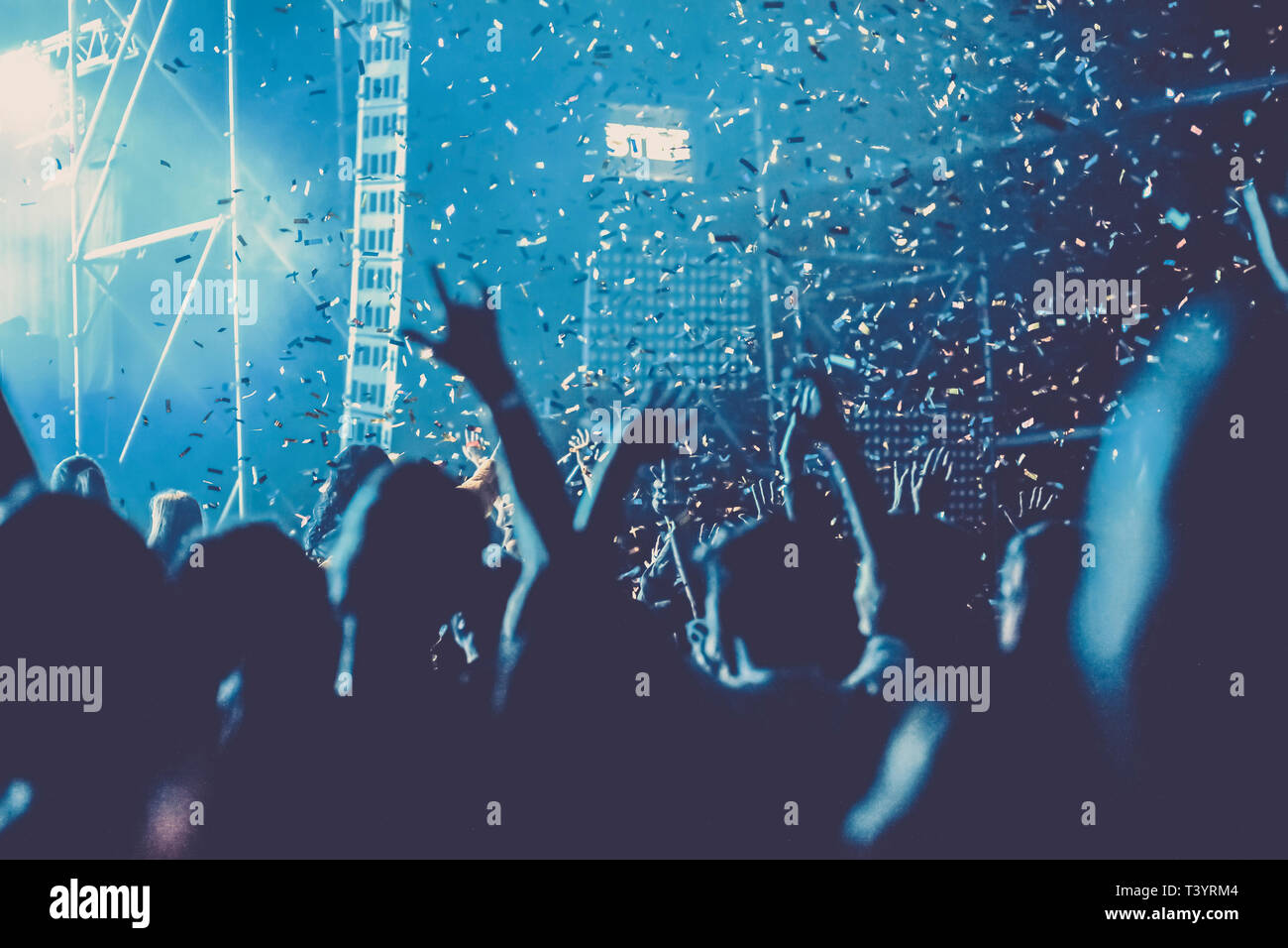 Group people arms up confetti hi-res stock photography and images - Alamy