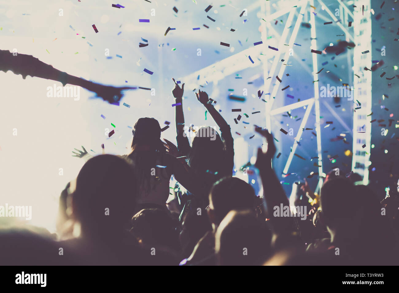 Group people arms up confetti hi-res stock photography and images - Alamy