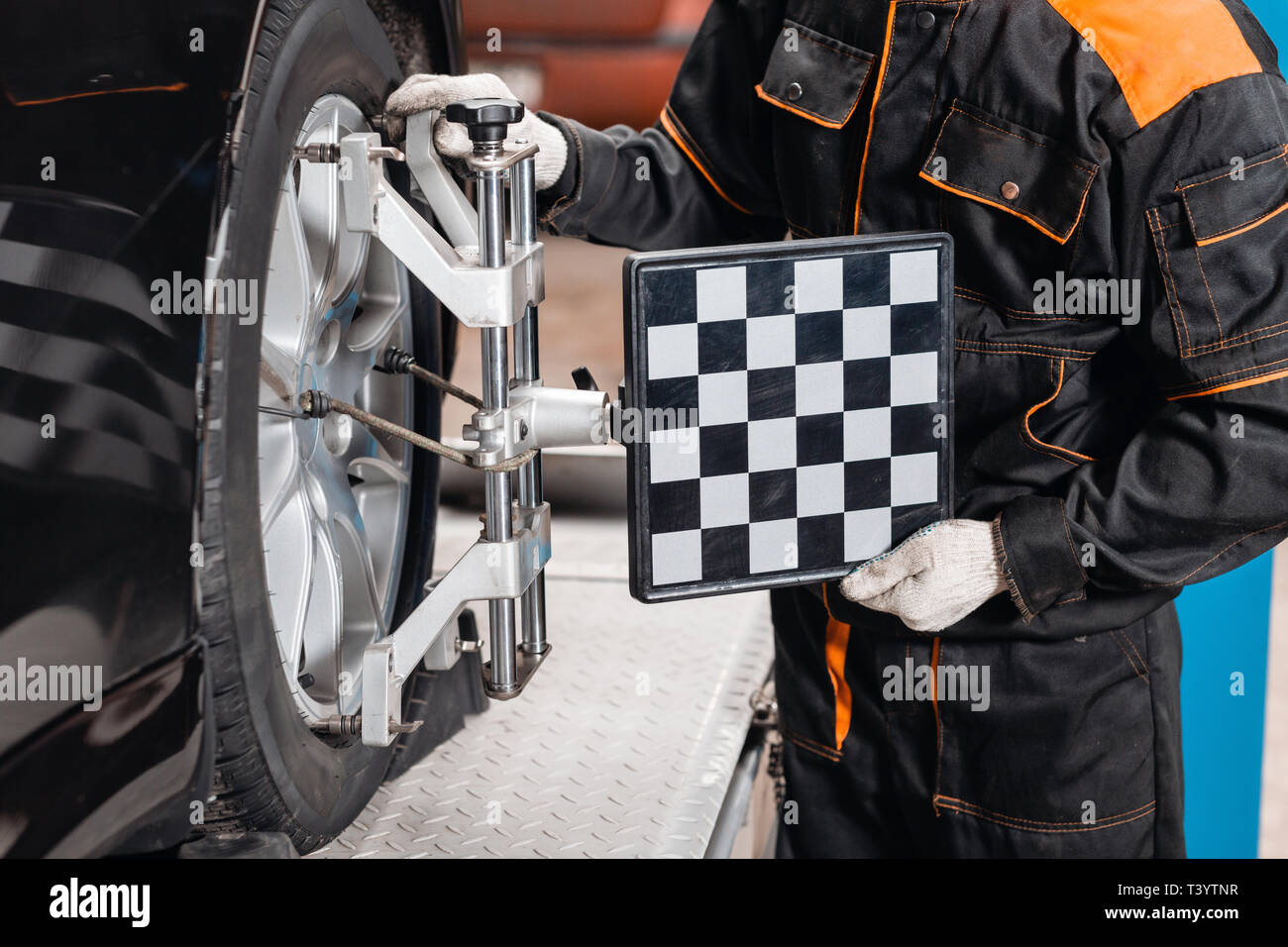 collapse-convergence. auto mechanic sets the car for diagnostics and ...