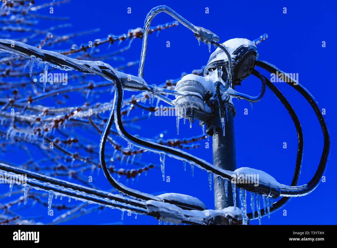 Electrical box installation with crystal icicles hanging from the wires ...