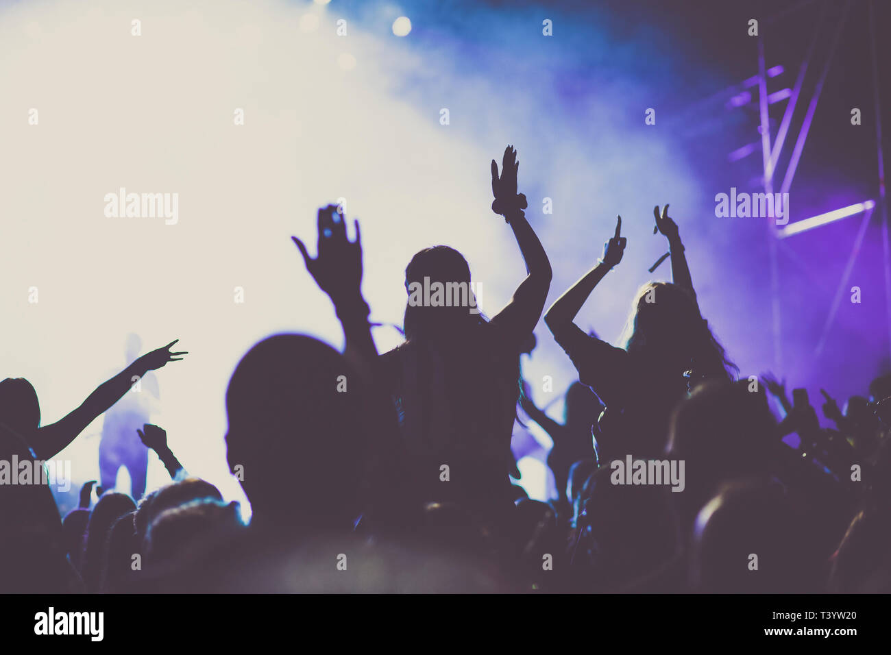 Crowd with raised up hands dancing in nightclub hi-res stock ...