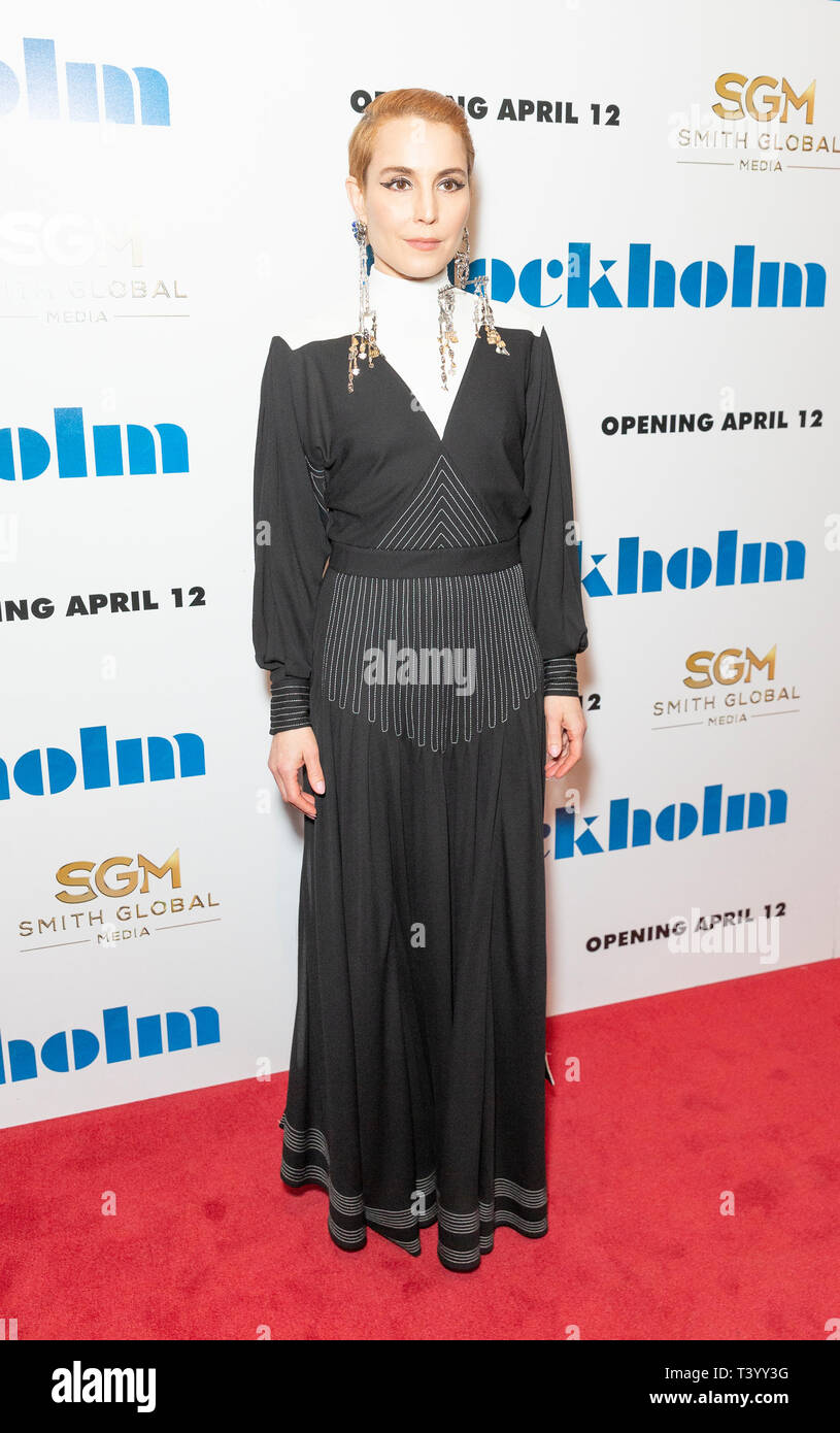 Noomi Rapace wearing dress and earings by Givenchy attends premiere of ...