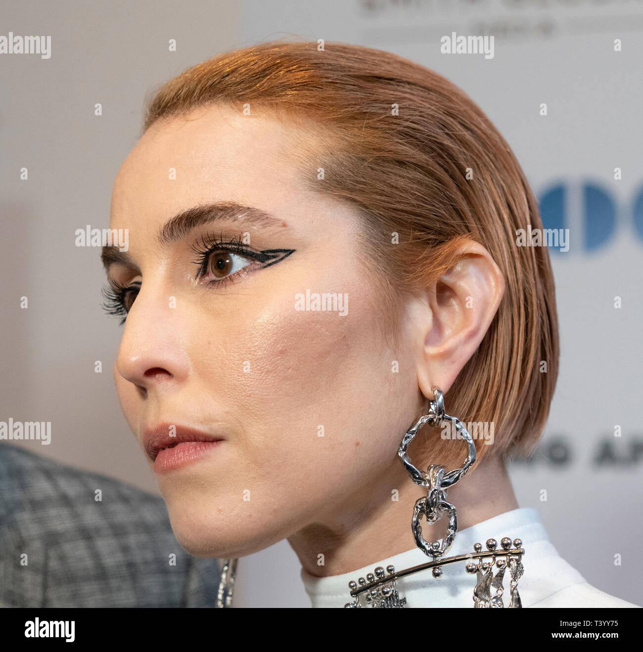 Noomi Rapace wearing dress and earings by Givenchy attends premiere of ...
