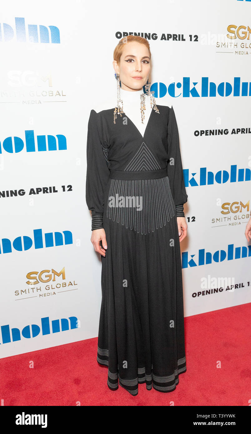 Noomi Rapace wearing dress and earings by Givenchy attends premiere of ...