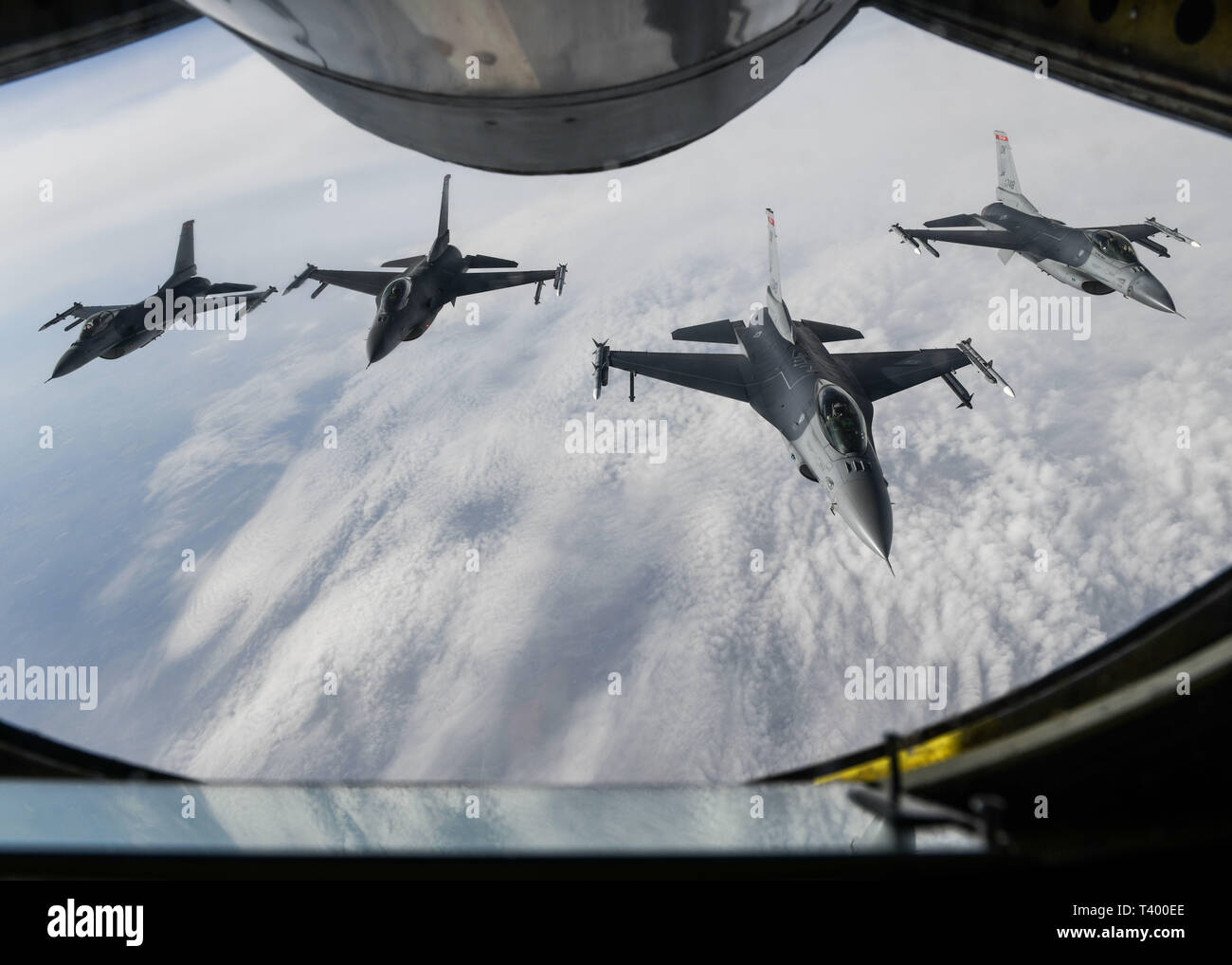 Four F-16 Vipers from the 138th Fighter Wing fly in formation behind a ...