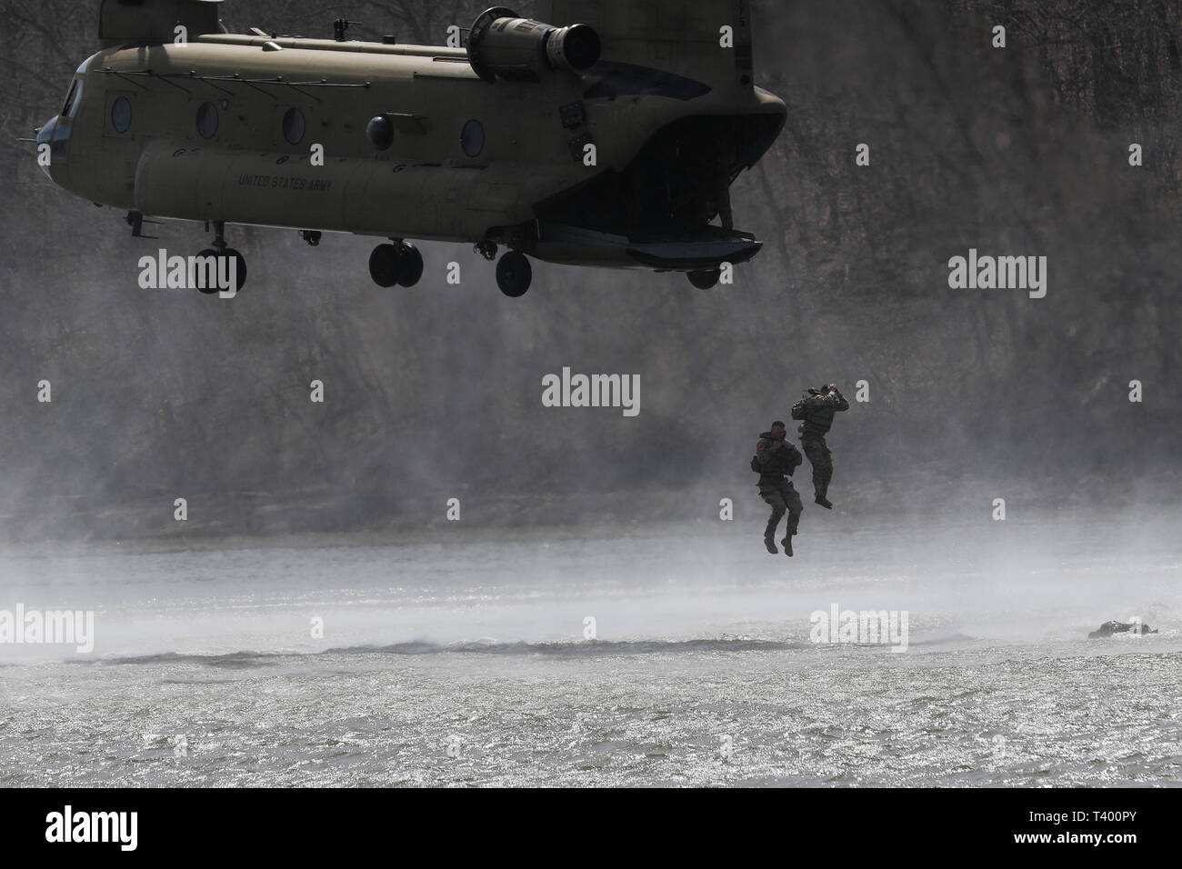 U.S. Army Sappers leap out of a Chinook helicopter into the Lake of the ...