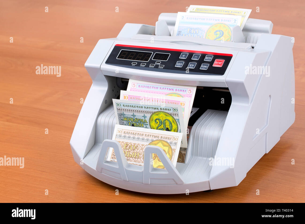 Old money from Kazakhstan in a counting machine Stock Photo - Alamy