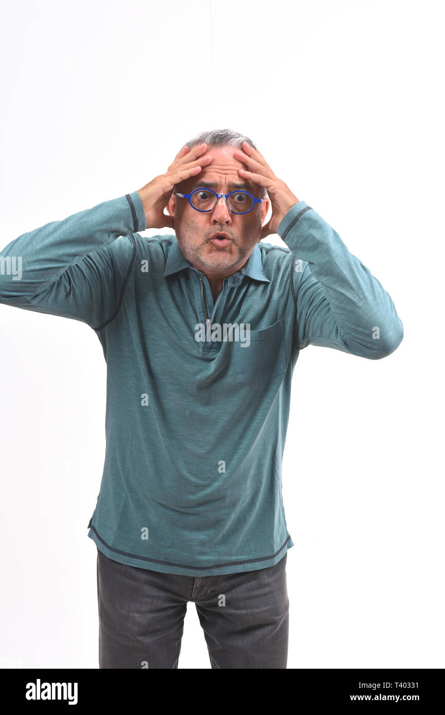 man with expression of forgetfulness or surprise on white background ...