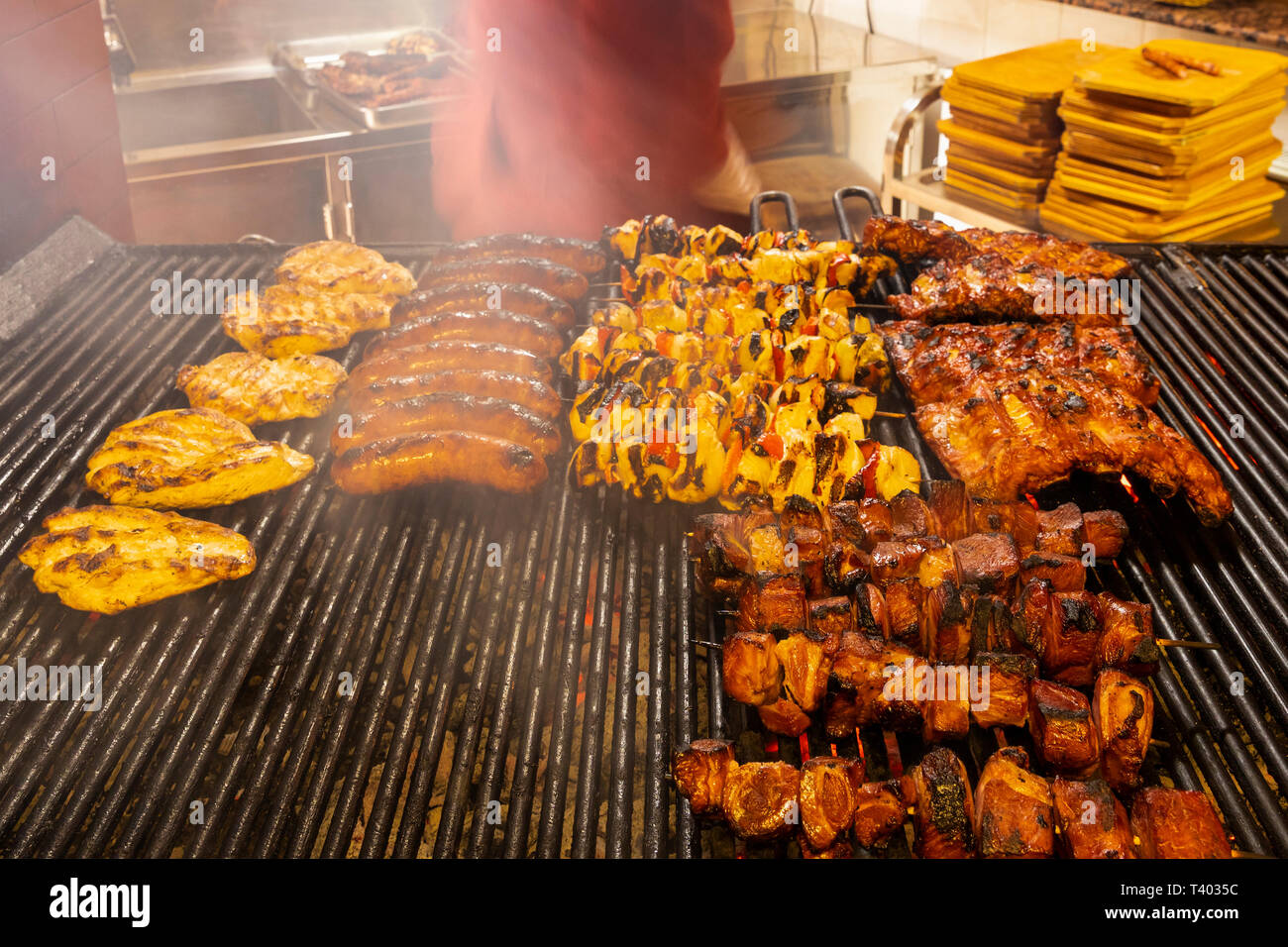 Grilled meat on a hot grill. Specialty meat sold as street food Stock ...