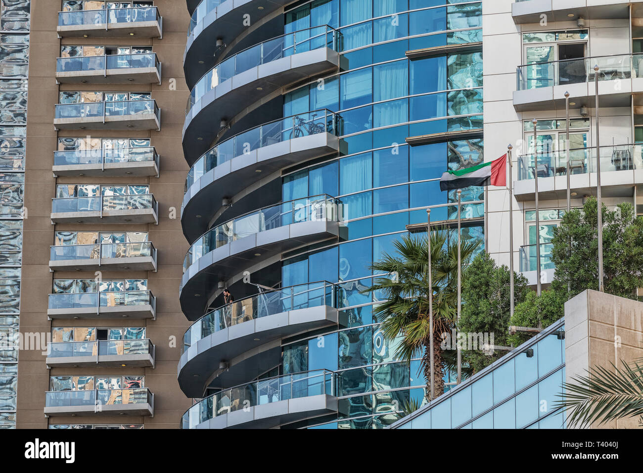 closed frame of skyscrapers in dubai with balconies. With UAE flag ...