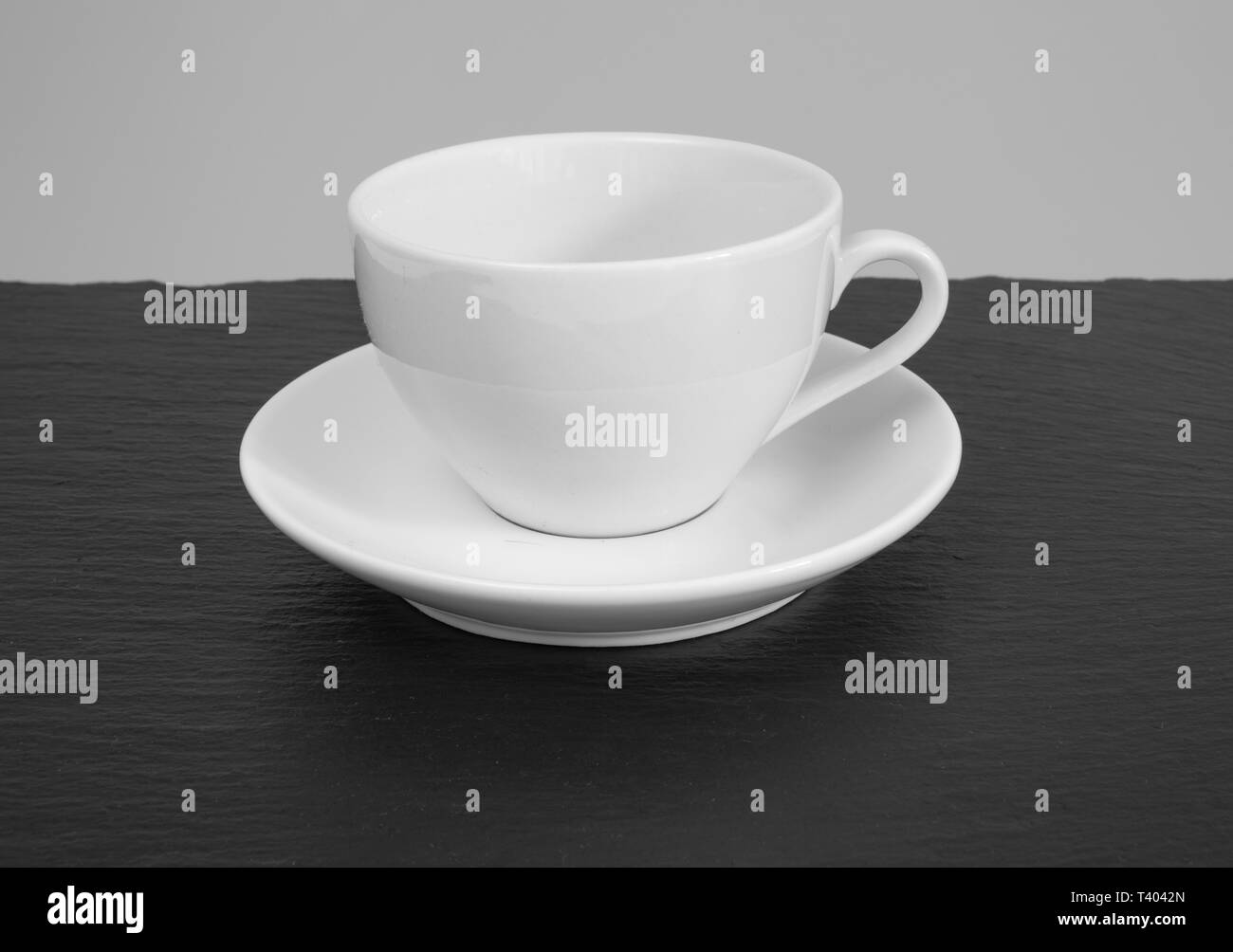 Wooden empty plate isolated Black and White Stock Photos & Images - Alamy