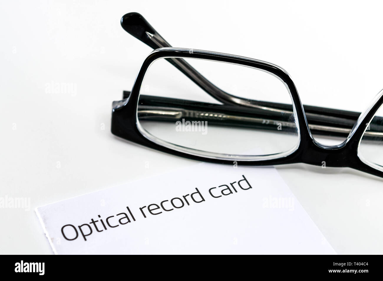 Optical record card with a pair of glasses isolated against a plain ...