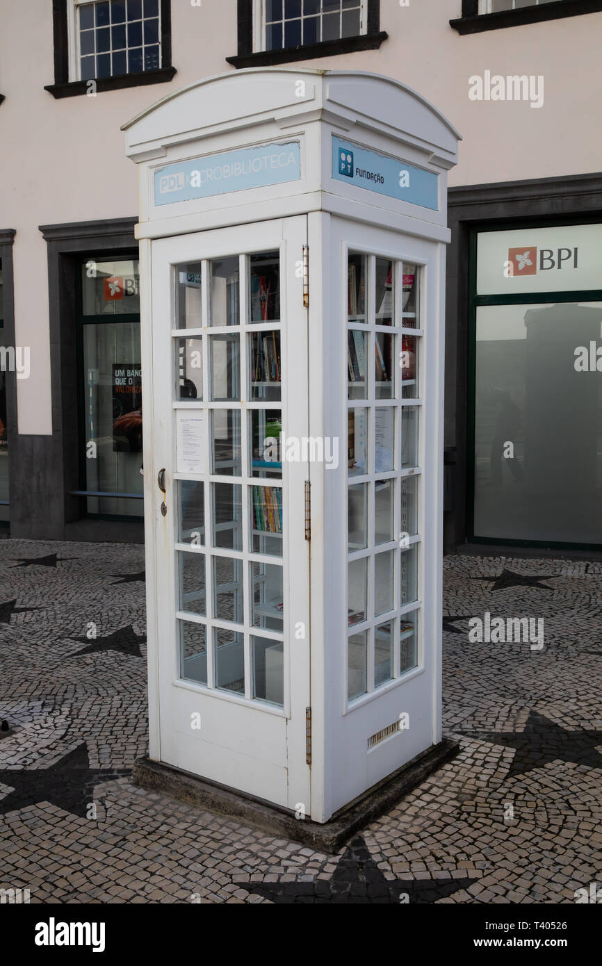 White telephone box is used as a library in São Miguel The Azores Stock ...
