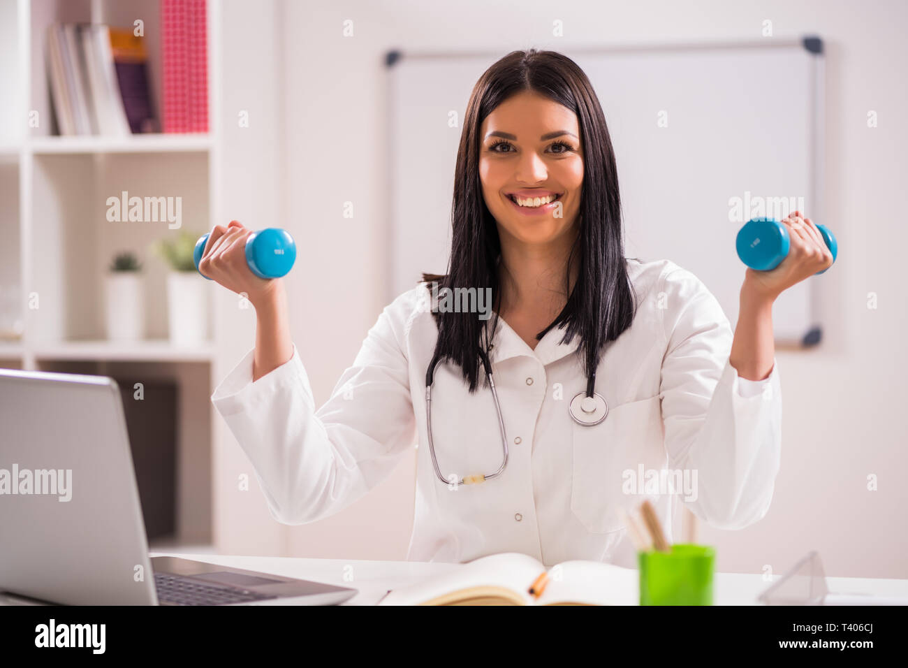 Young doctor is talking about importance of fitness Stock Photo - Alamy