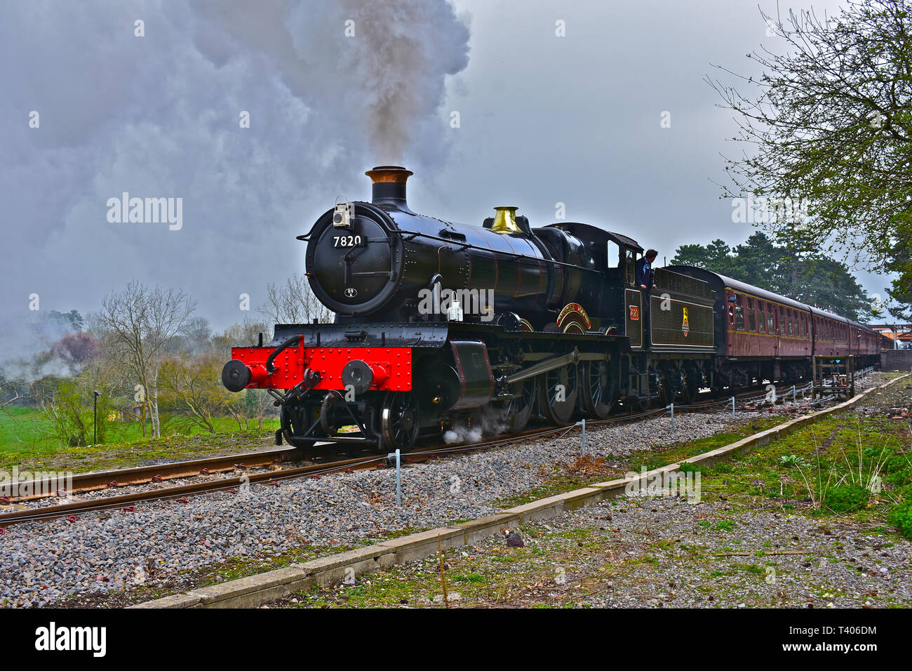 Engine No. 7820 (Dinmore Manor) steams away from Broadway station for the journey to Cheltenham ...