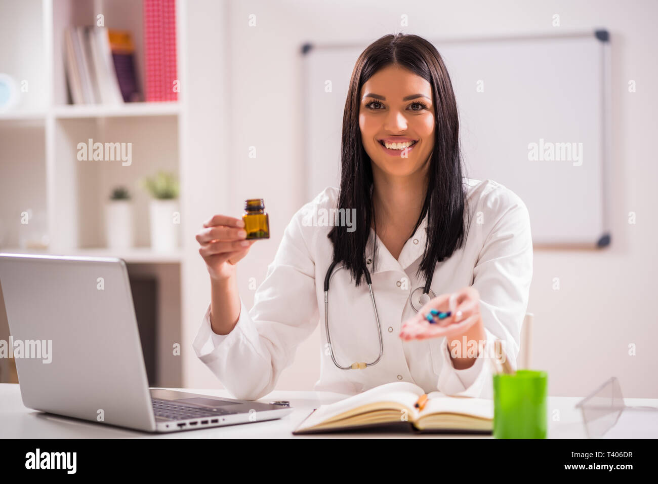 Young happy woman taking pills hi-res stock photography and images - Alamy
