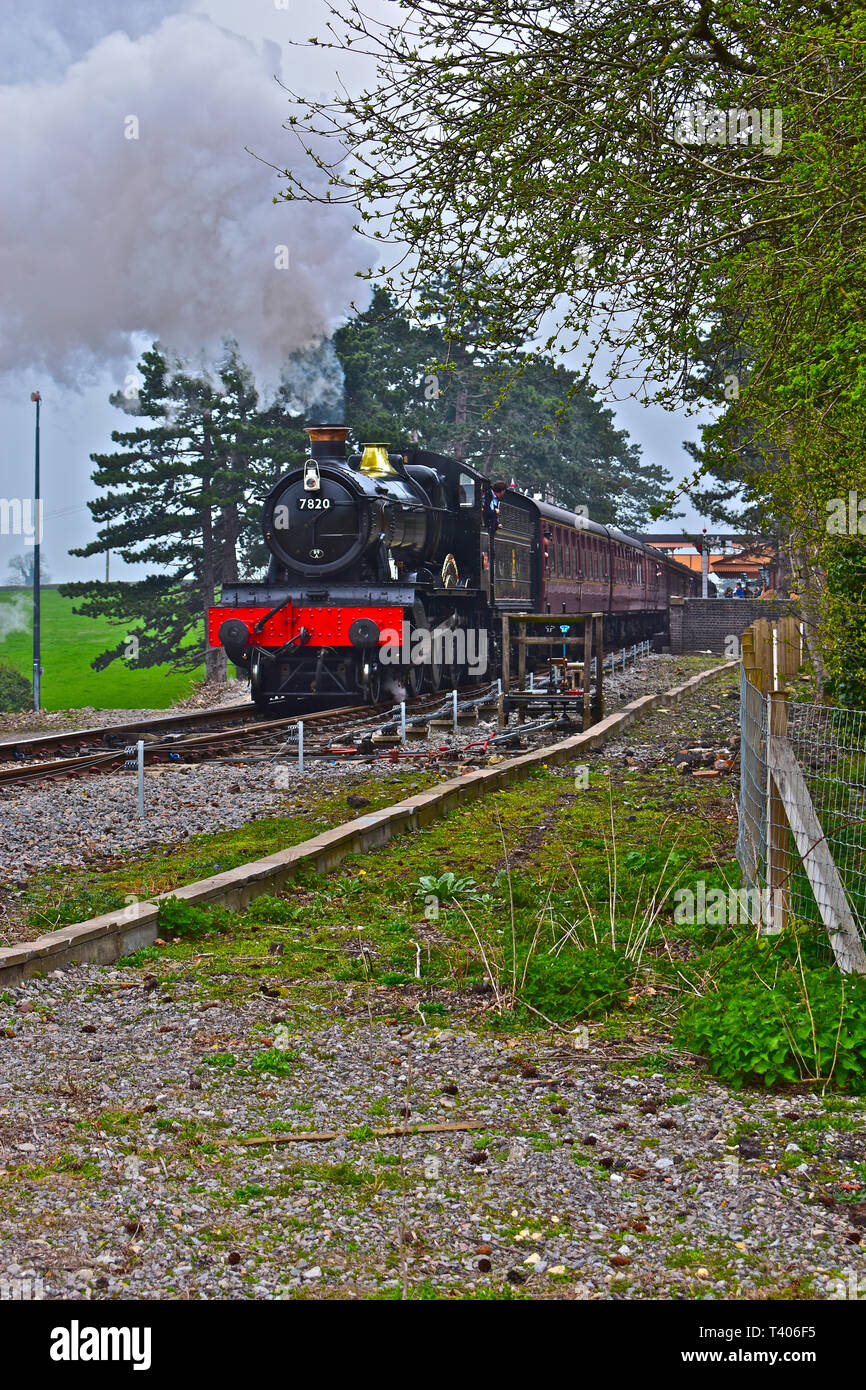 Engine No. 7820 (Dinmore Manor) steams away from Broadway station for the journey to Cheltenham ...