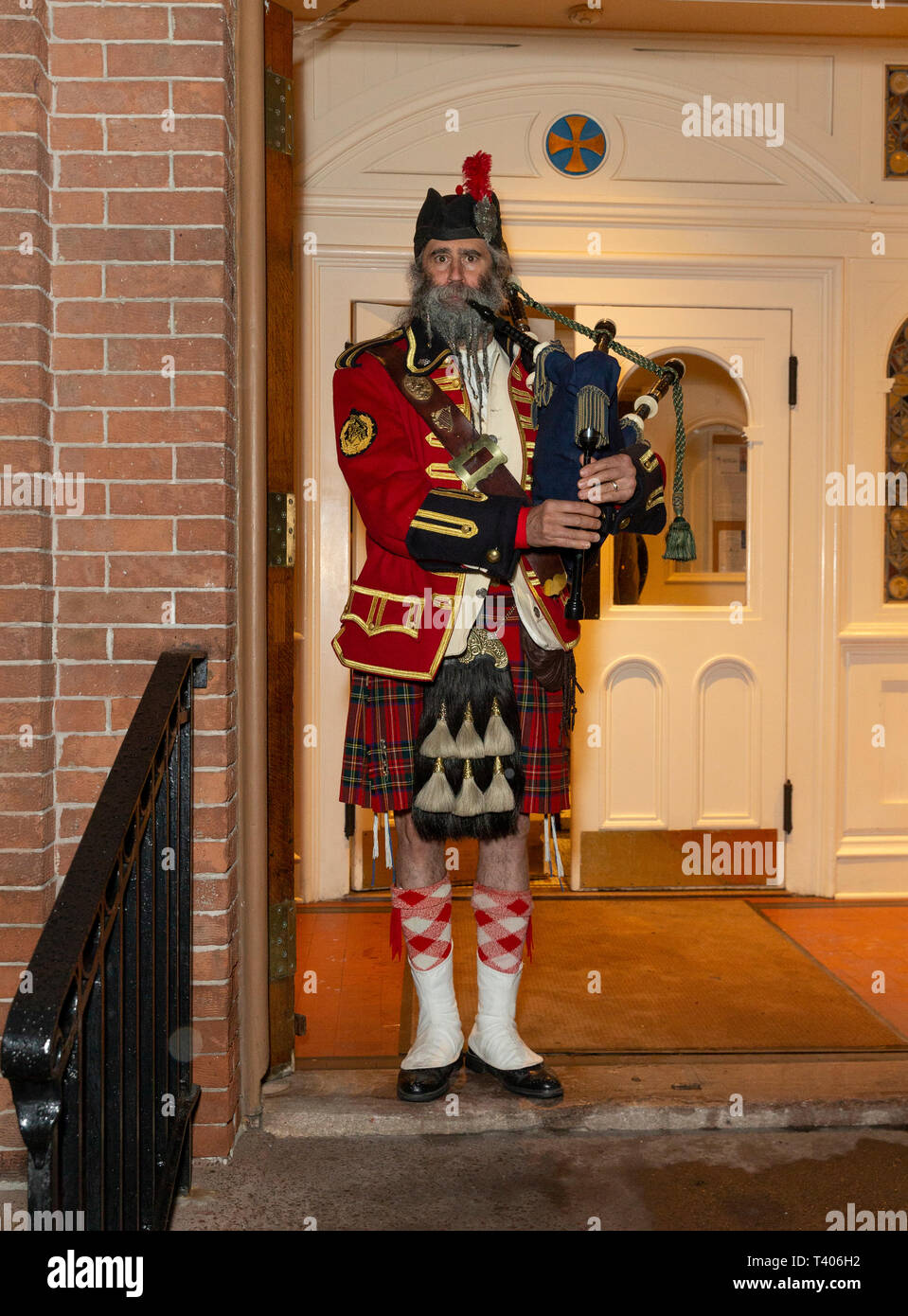 New York, NY - April 5, 2019: Pipe player stand guard at Dressed to ...