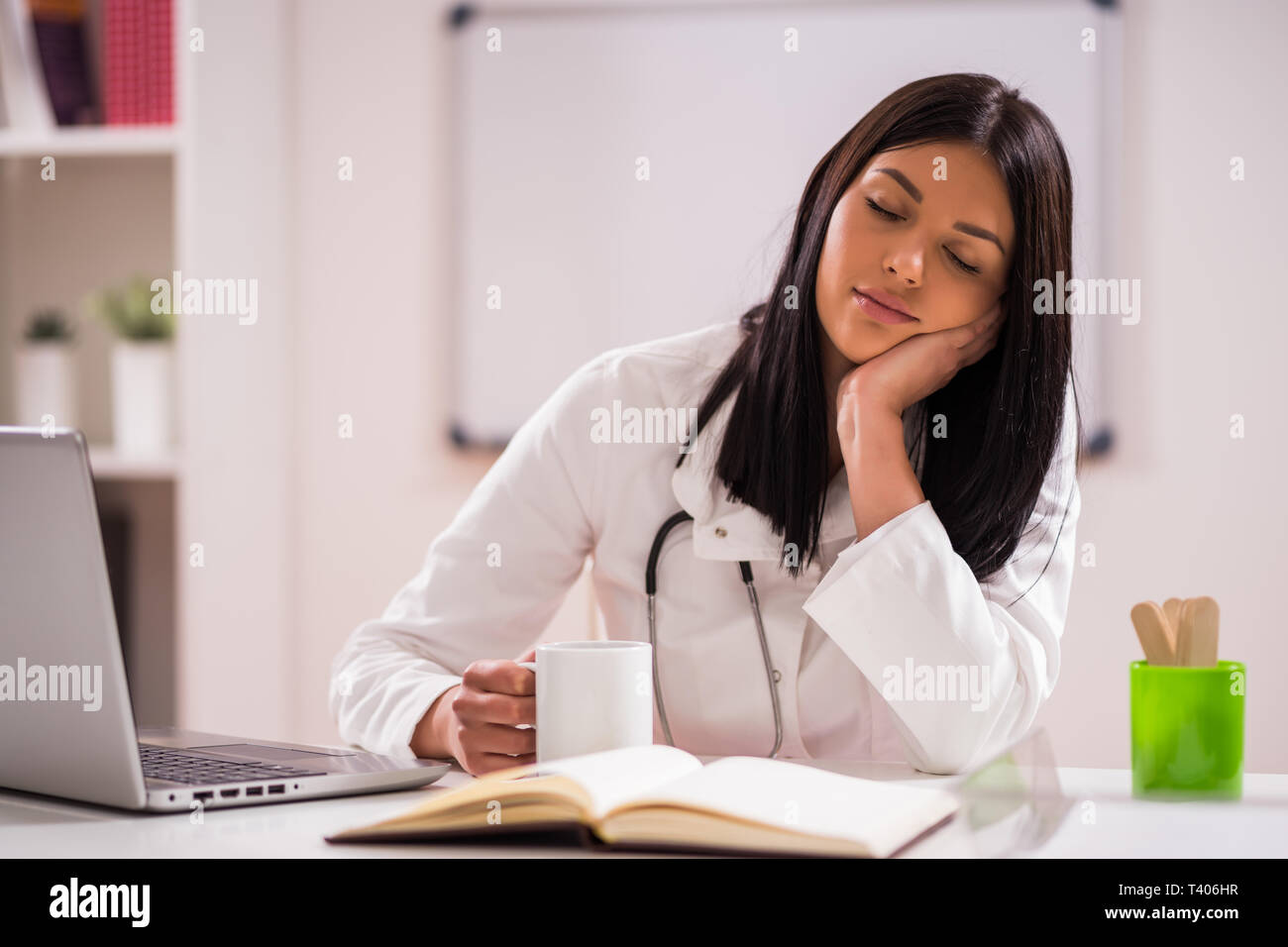Sleeping doctor female doctor hi-res stock photography and images - Alamy