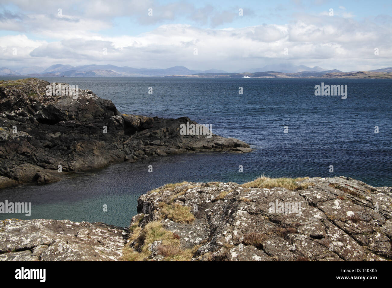 Coastal rocks and shoreline of the Firth of Lorn from near Grass Point ...