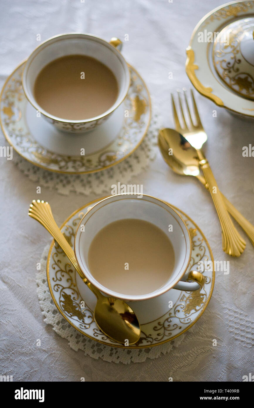 vintage tea cups layed out at a formal setting Stock Photo - Alamy