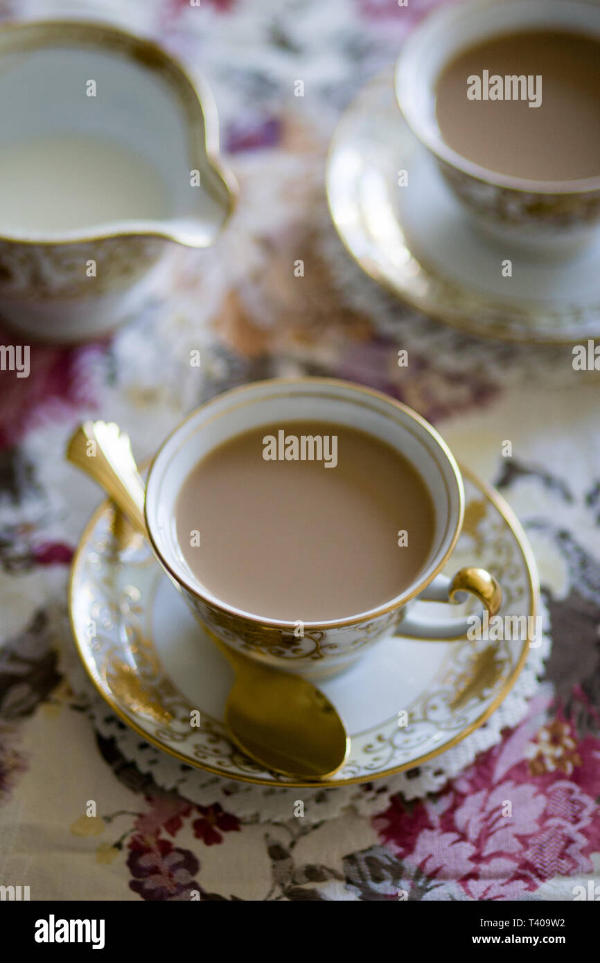 vintage tea cups layed out at a formal setting Stock Photo - Alamy