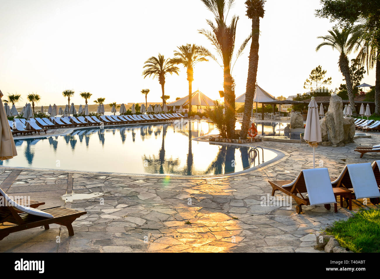 PATHOS, CYPRUS June 10, 2017. A number of sun loungers by the pool at ...