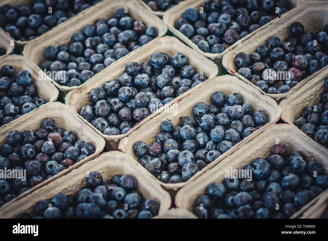 Blueberries for sale at food market - blueberry boxes Stock Photo - Alamy