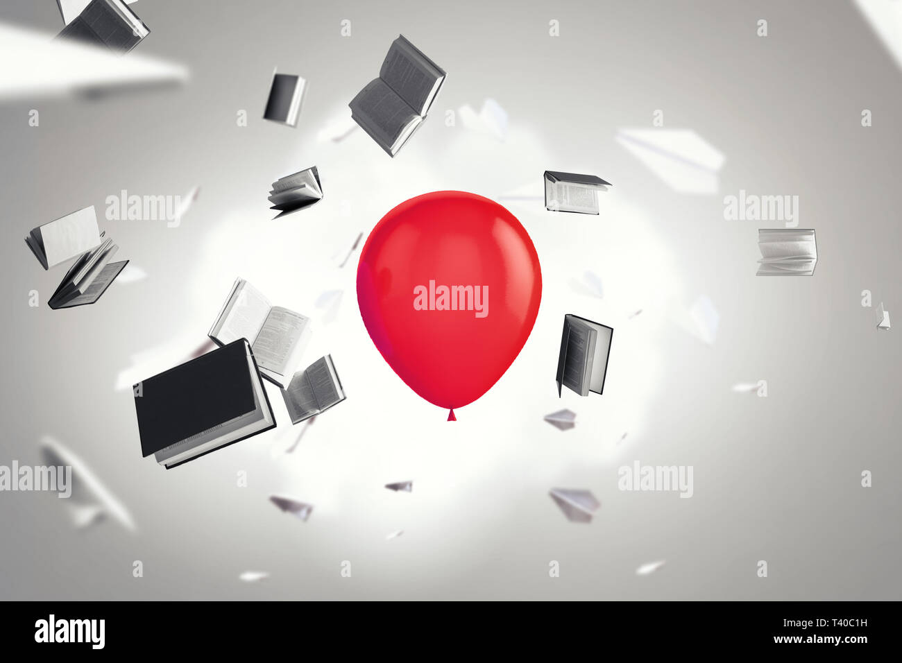 Flying books isolated on grey background with a red balloon Stock Photo ...