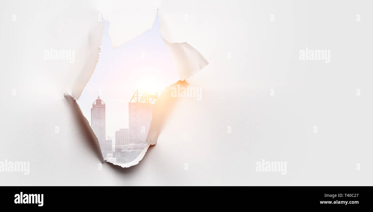 Paper torn hole effect on the wall. Mixed media Stock Photo - Alamy