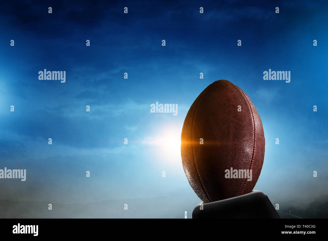 Night football arena in lights with a ball close up Stock Photo - Alamy