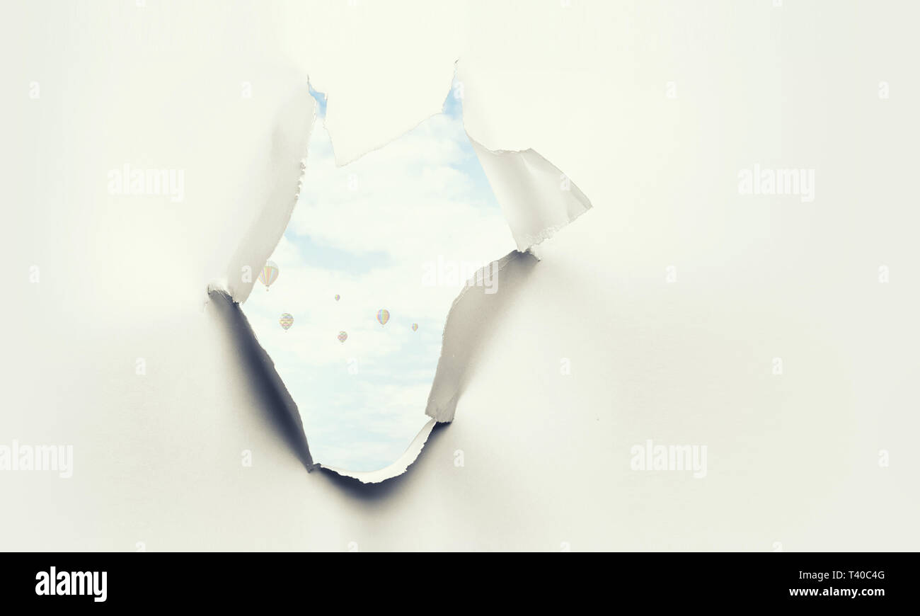 Effect of torn paper hole Stock Photo - Alamy