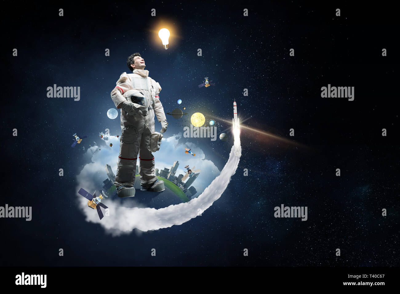 Spaceman and the planet Earth abstract theme Stock Photo - Alamy