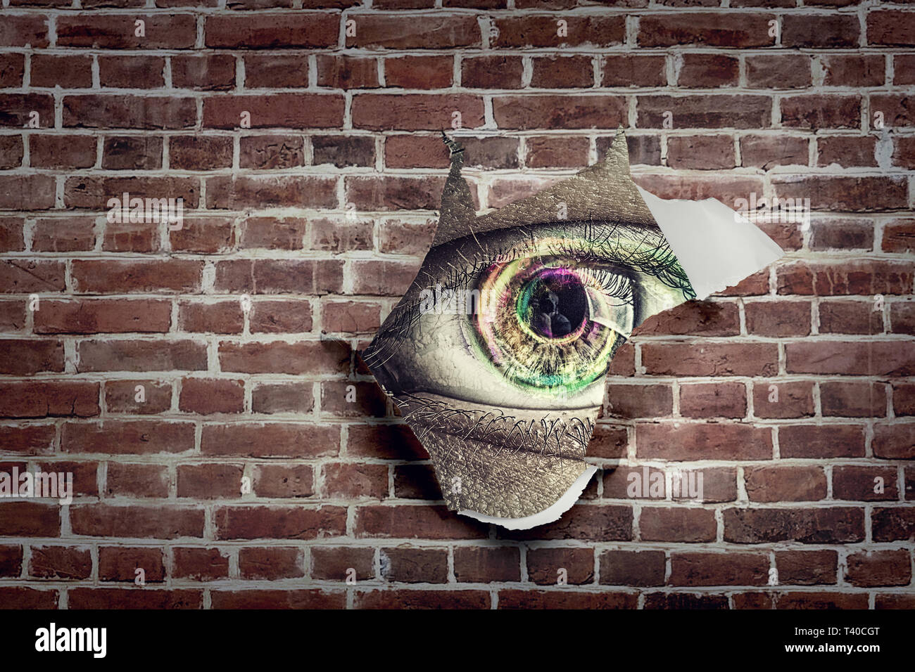 Eye looking through paper hi-res stock photography and images - Alamy