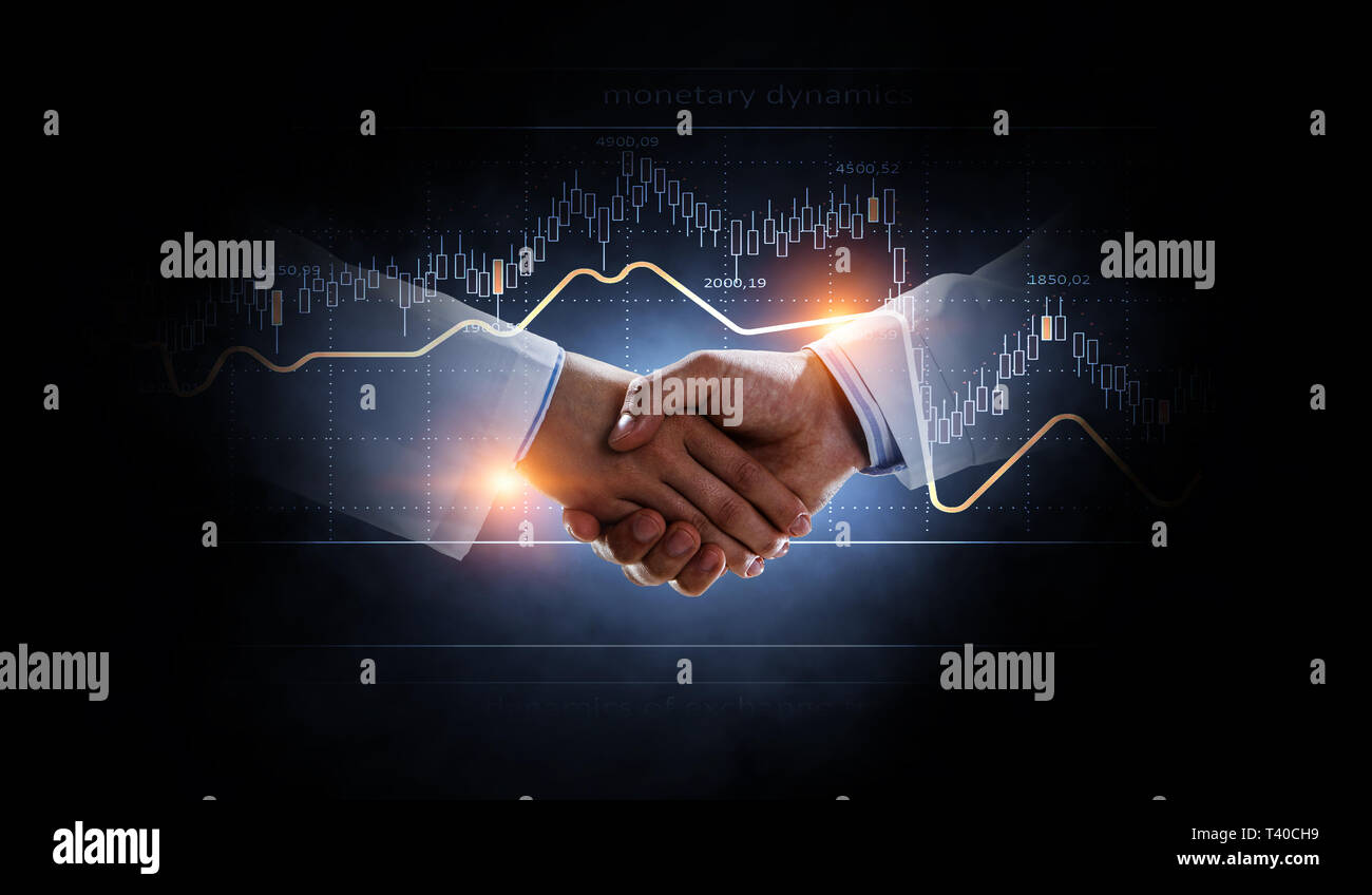 Business handshake by a man and a woman Stock Photo - Alamy