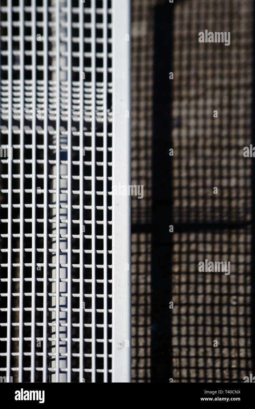The close-up and top view of the seat of a lattice bench casting ...